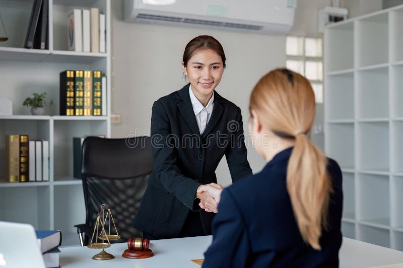 Lawyer Shaking Hands with a Client after a Successful Contract ...