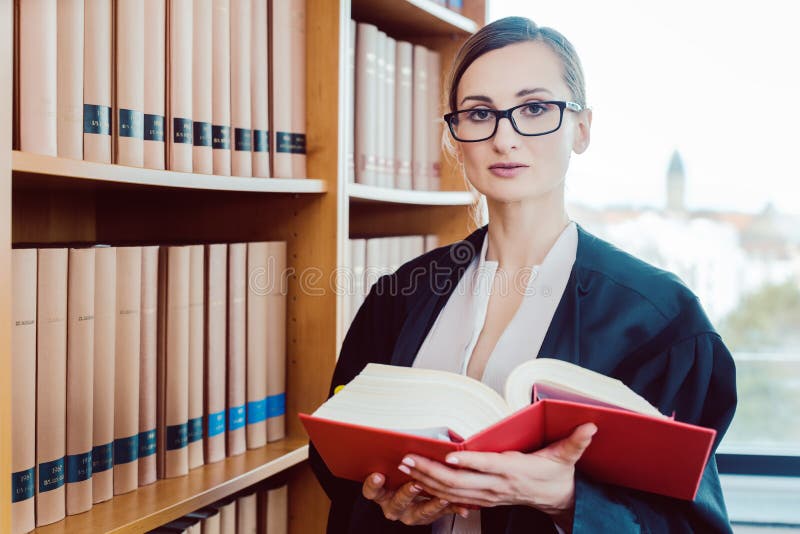 Lawyer Working on a Difficult Case Reading in the Library Stock Image ...