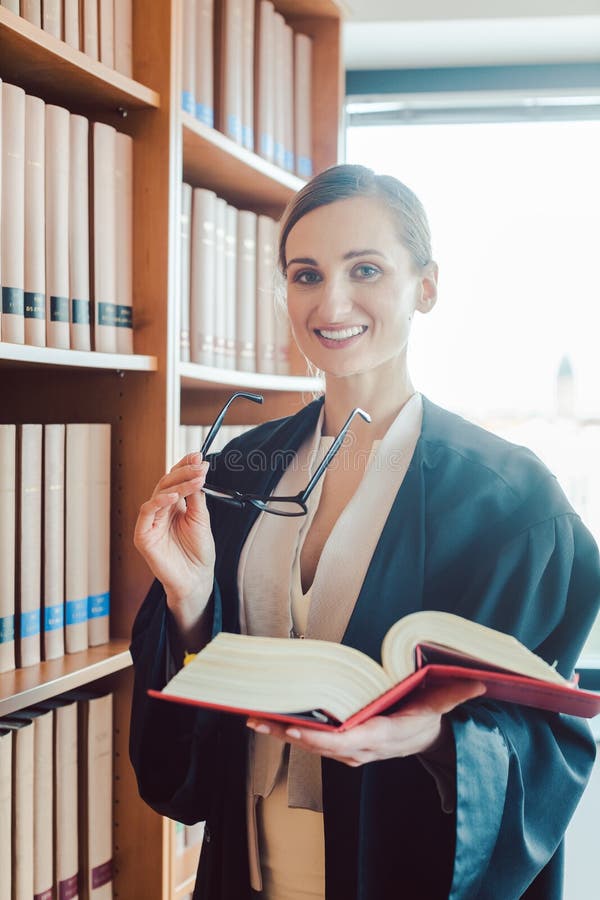 Lawyer Working on a Difficult Case Reading in the Library Stock Image ...