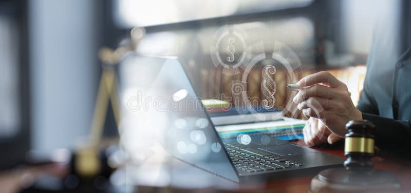 A Lawyer Working at a Laptop and a Virtual Screen with Laws Stock Photo ...