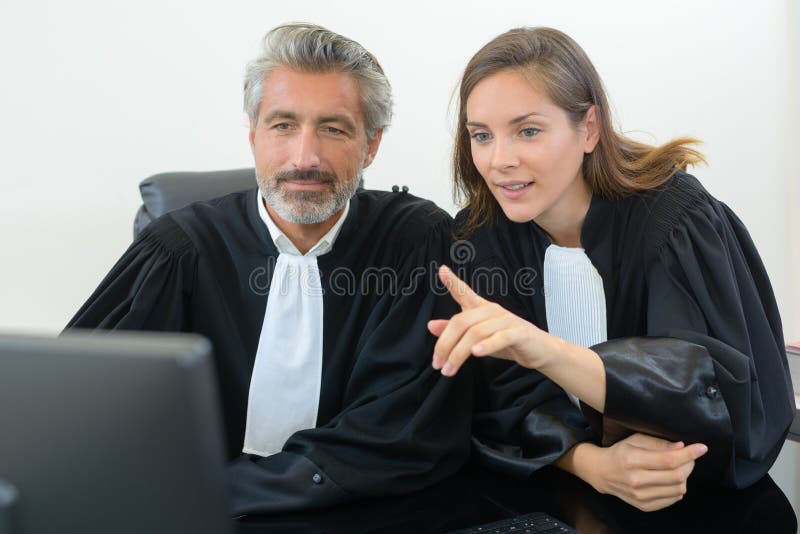Lawyers Looking at Computer in Court Gowns Stock Image - Image of ...