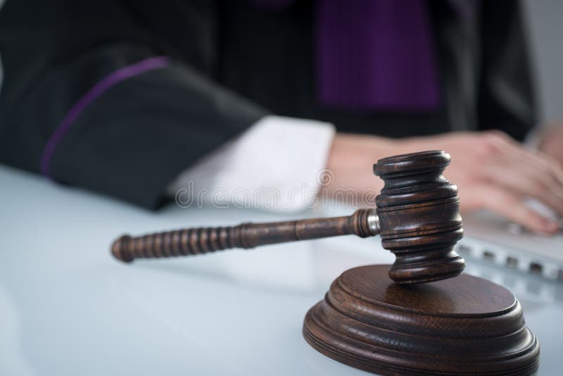 Lawyers Office. Judge with a Gavel in Hand at the Open Computer Stock ...