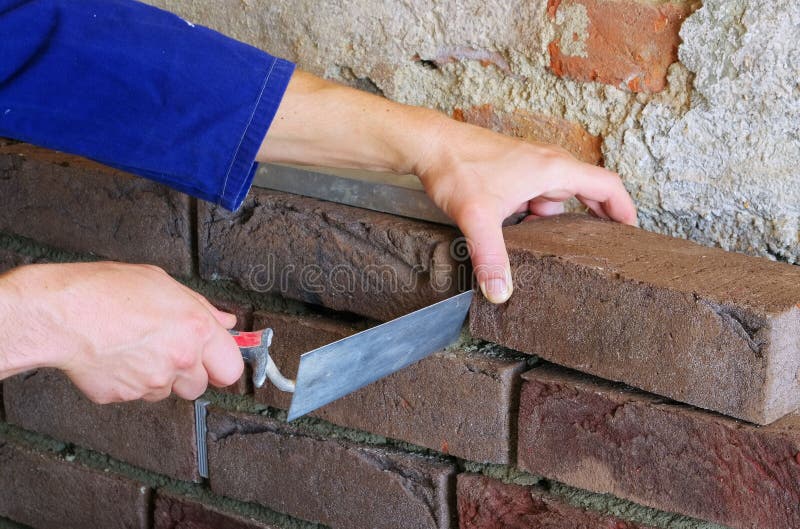Lay a brick wall stock photo. Image of construction, bricklayer - 32936378