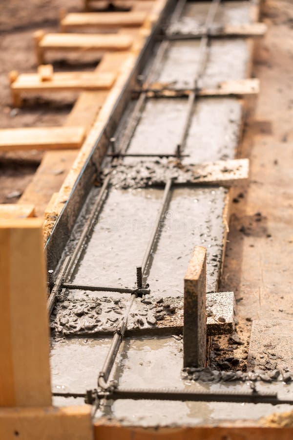 Lay of the Cement or Concrete into the Foundation Formwork with ...