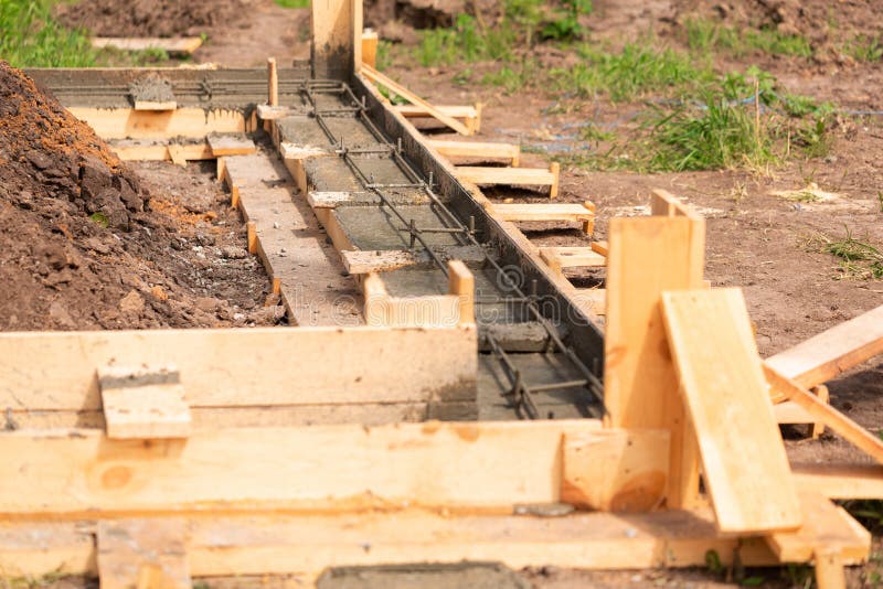 Lay of the Cement or Concrete into the Foundation Formwork with ...
