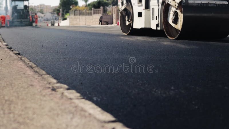 A Layer of Freshly Laid Asphalt in the Rays of the Setting Sun. Road ...