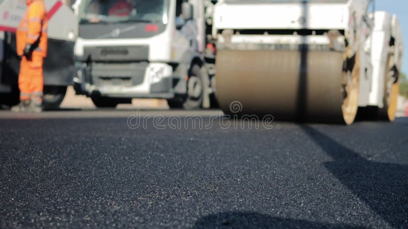 A Layer of Freshly Laid Asphalt. Road Surface Repair. Construction of a ...