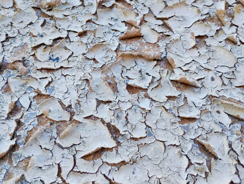 A Layer of Mud Mixed with Black Dye that Cracks on a Concrete Floor ...