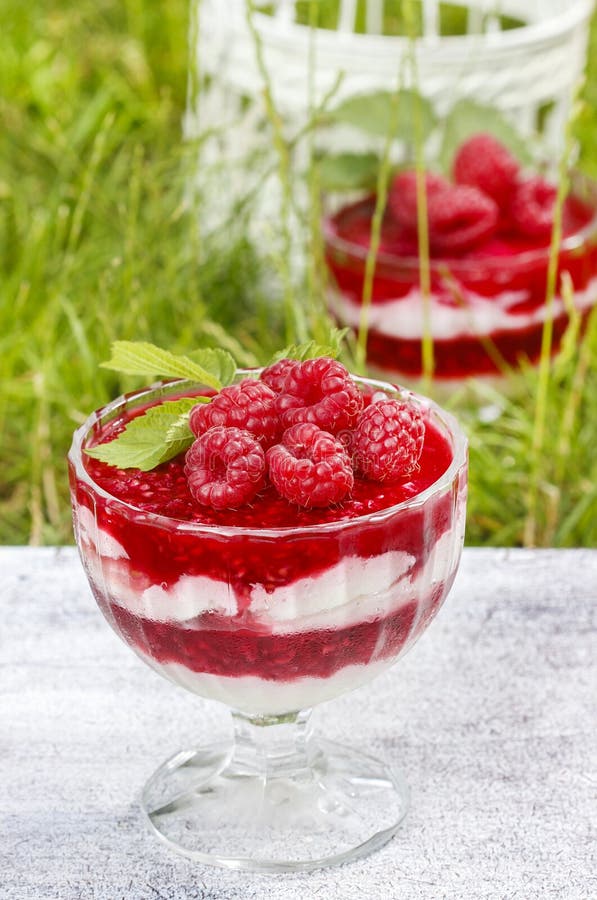 Layer Raspberry Dessert on Garden Party Table. Lush Grass in the Stock ...