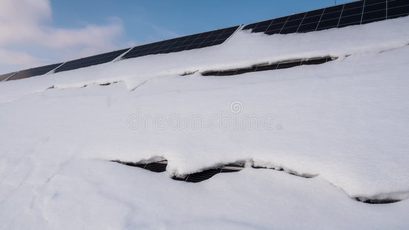 A Layer of Snow on the Panels of a Solar Power Plant. Green Energy ...
