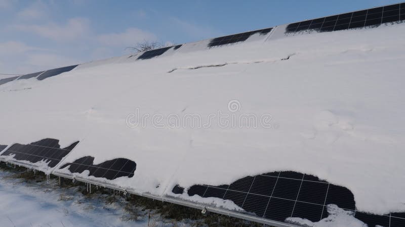 A Layer of Snow on the Panels of a Solar Power Plant. Green Energy ...