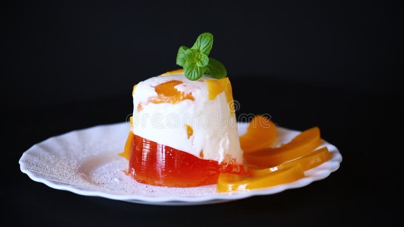 Layered Fruit Dessert with Jelly, Cream and Fresh Mint Stock Footage ...