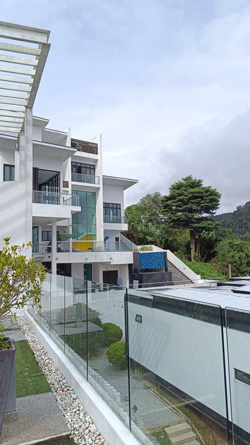 Layered Hillside House with Cloudy Sky Stock Image - Image of house ...