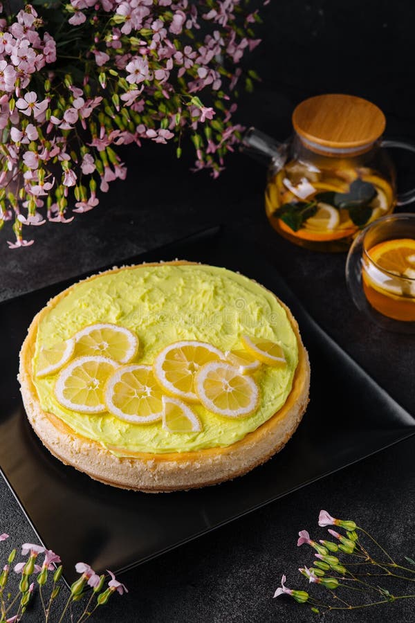 Layered Lemon Cheesecake on Black Plate Stock Image - Image of ...
