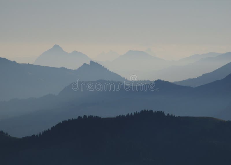 Layered Mountain Ranges in Different Shades of Blue Stock Image - Image ...
