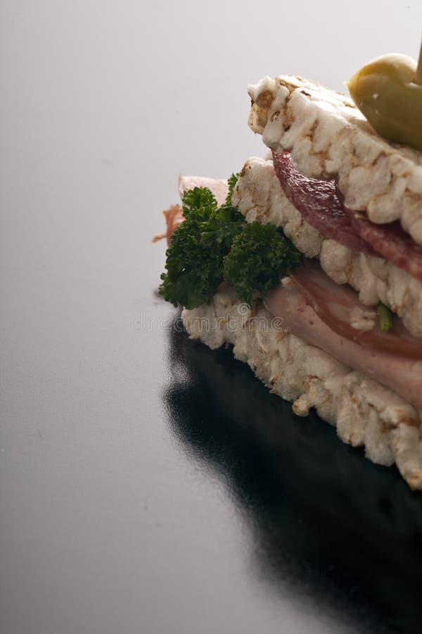 Layered Rice Cake and Cold Meats Stock Photo - Image of olive ...