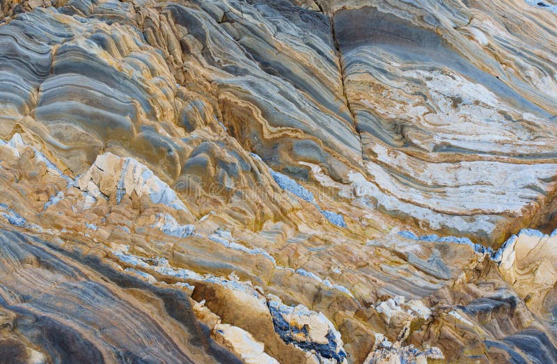 Layered Rocks Background in Shades of Gold and Blue Stock Image - Image ...