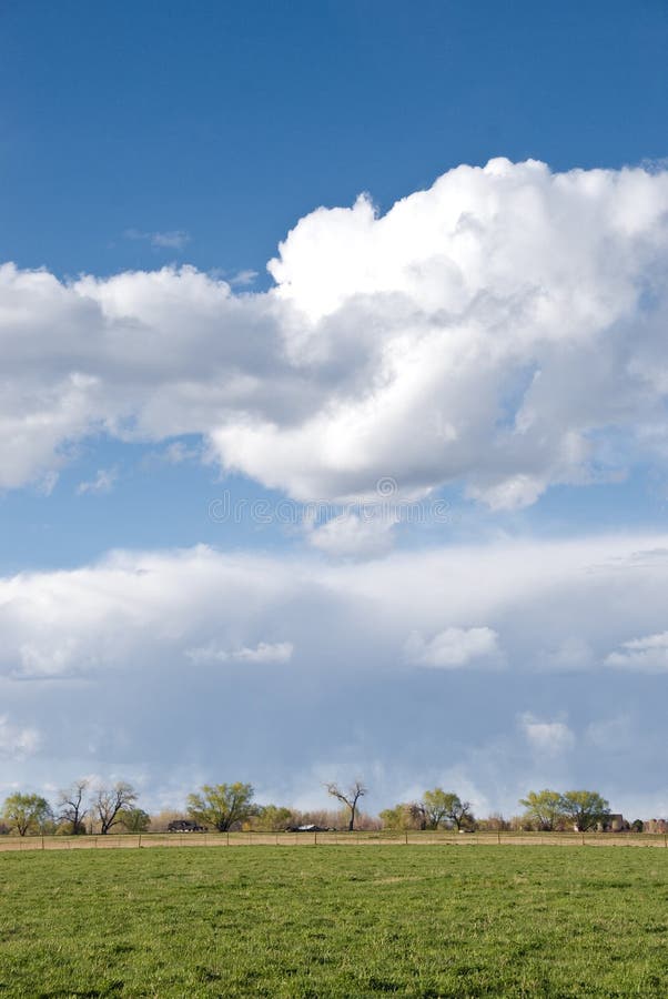 Layers of Clouds and Sky Above and Open Field Stock Image - Image of ...