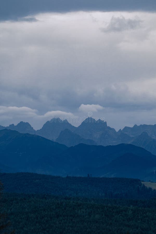 Layers of a Mountain Range in Shades of Blue, Vertical Stock Photo ...
