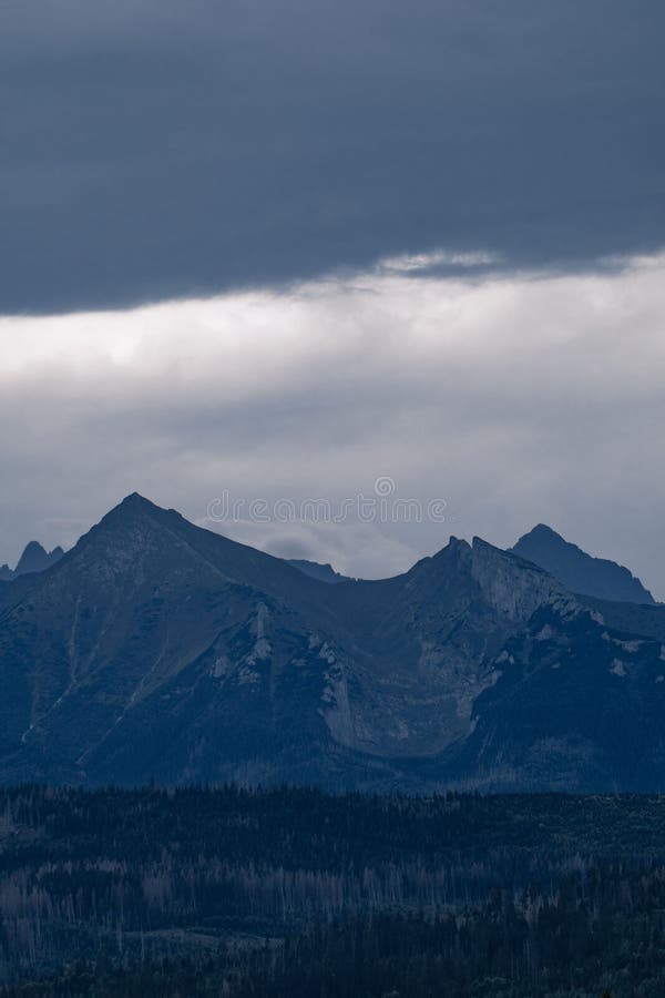 Layers of Mountain Range in Shades of Blue, Vertical Stock Photo ...