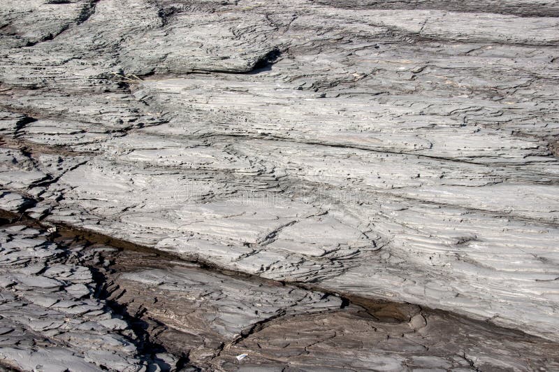 Layers of Rock Eroded Away with a Small Puddle in the Cracks Stock ...
