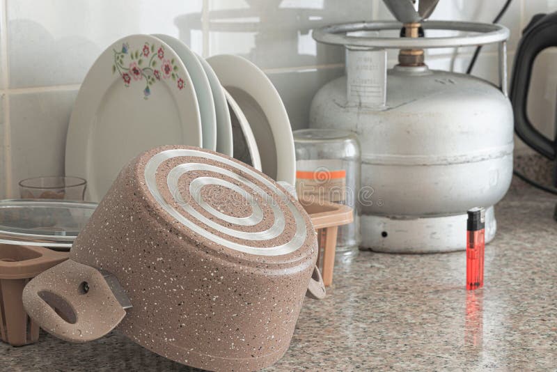 Layers and Small Propane Tube on the Kitchen Counter. a Red Lighter and ...