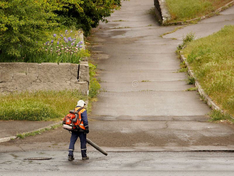 Laying Asphalt by Workers. Road Construction. Modern Technology of ...