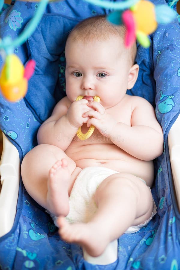 Laying Baby Girl Using Teether Stock Photo - Image of baby, teethers ...