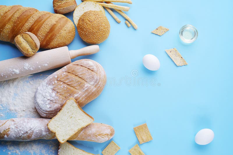 Laying Bread on a Blue Background Stock Photo - Image of wheat, bakery ...