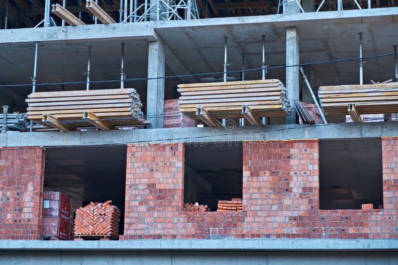 Laying Bricks on a Construction Site, Early Stage of Construction ...