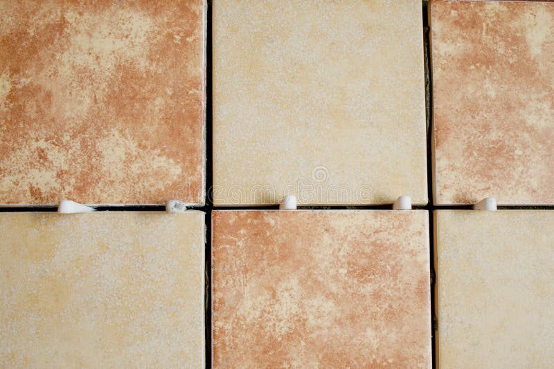 Laying Ceramic Tiles with the Help of Crosses for a Tile by during Wall ...