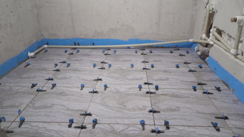 Laying of Ceramic Tiles at the Construction Site Stock Footage - Video ...