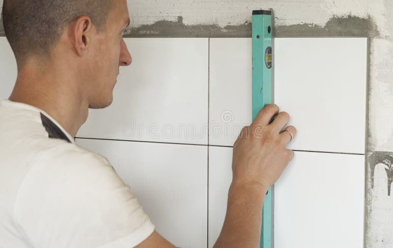 Laying ceramic tiles stock photo. Image of tiles, male - 74598004