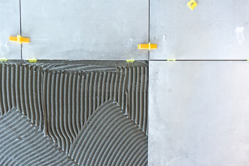 Laying Ceramic Tiles with Tile Leveling System and Cement Adhesive ...