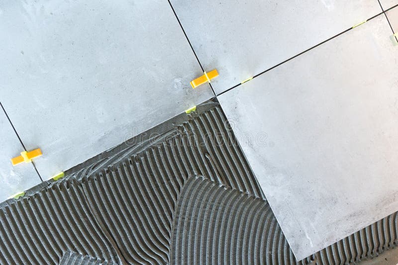 Laying Ceramic Tiles with Tile Leveling System and Cement Adhesive ...