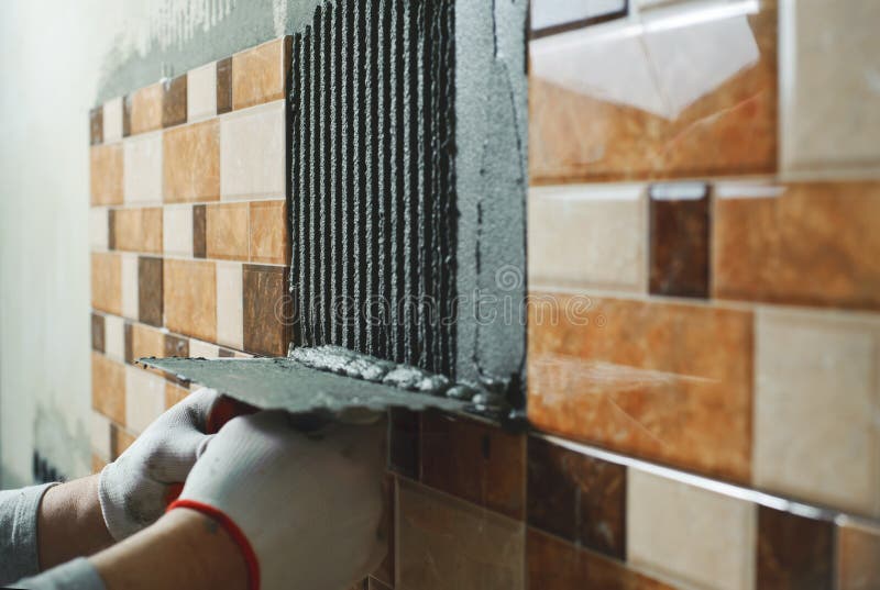 Laying Ceramic Tiles. stock photo. Image of wall, construction - 47529484