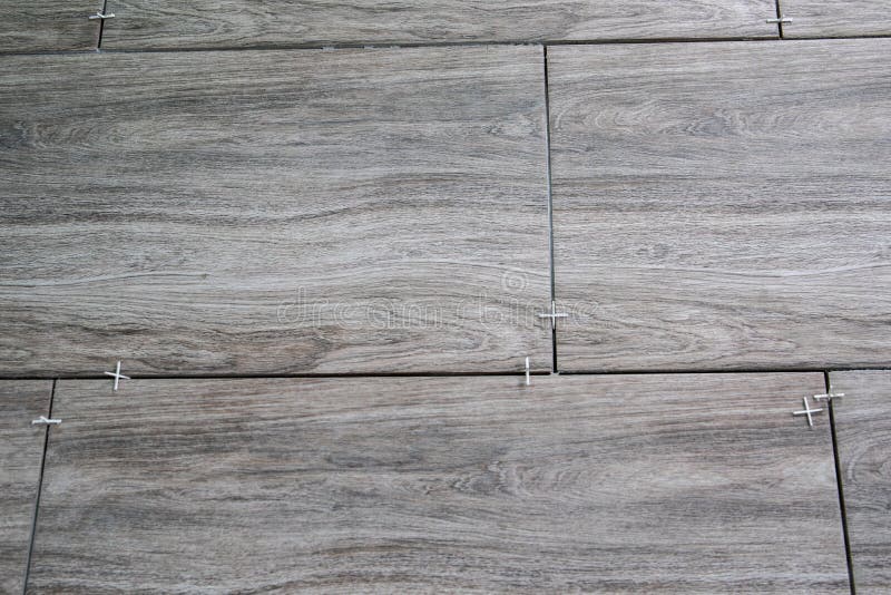 Laying Ceramic Tiles Using Plastic Crosses. Renovation or Repair ...