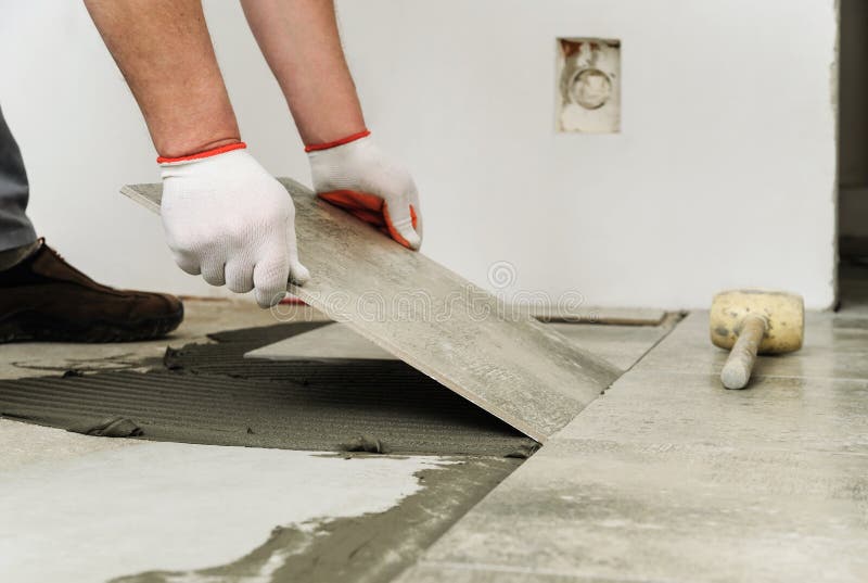 Laying Ceramic Tiles. stock photo. Image of manual, adhesive - 69366486