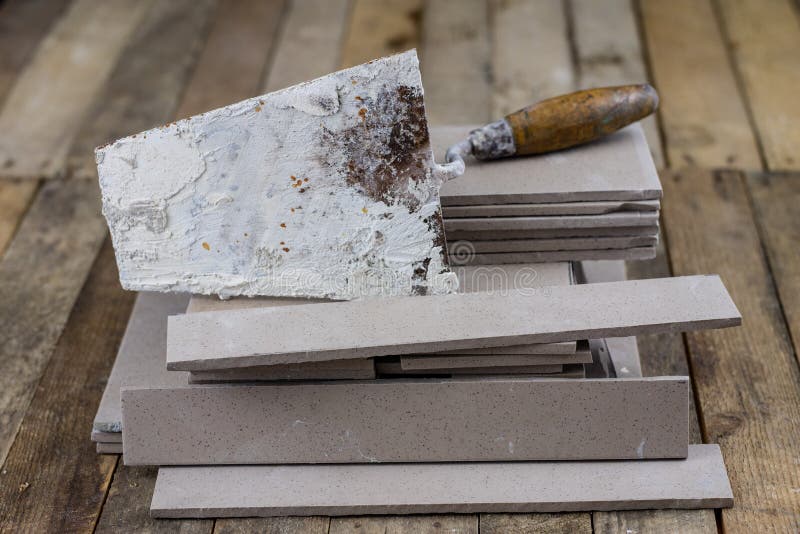 Laying and Cutting Tiles. Tools and Building Materials at a Work Stock ...