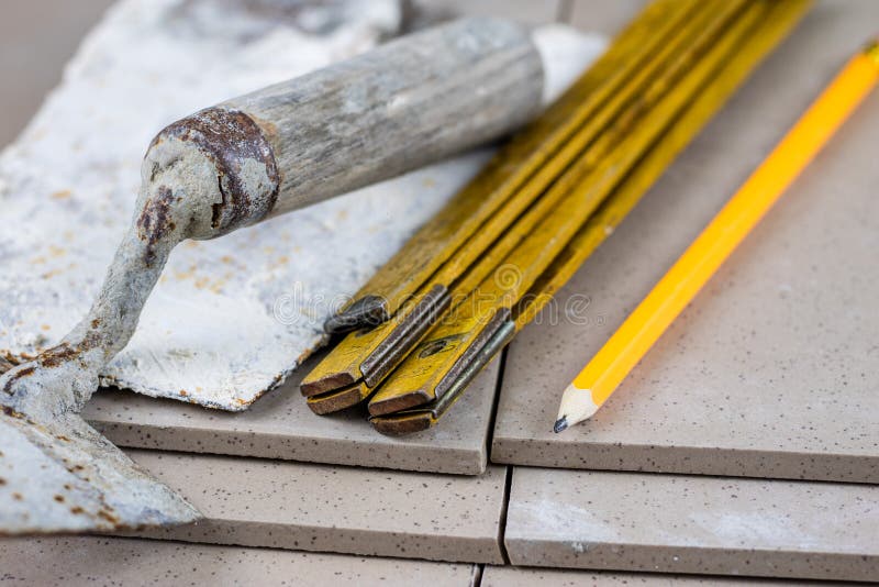 Laying and Cutting Tiles. Tools and Building Materials at a Work Stock ...