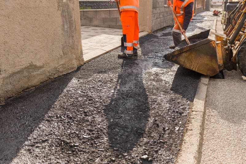 Laying Down a New Asphalt Layer for a Sidewalk Stock Photo - Image of ...