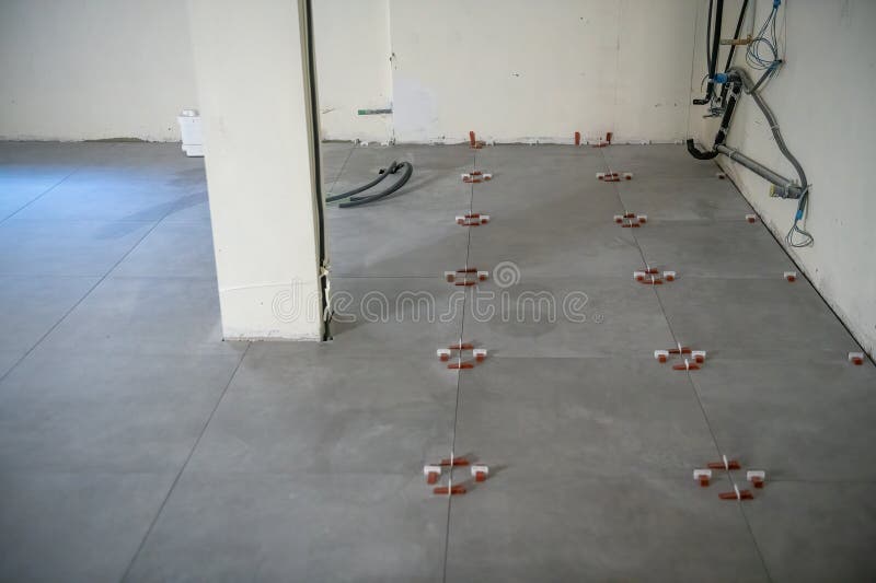 Laying Down Tiles in a New House. Room Witha New Set of Tiles Stock ...