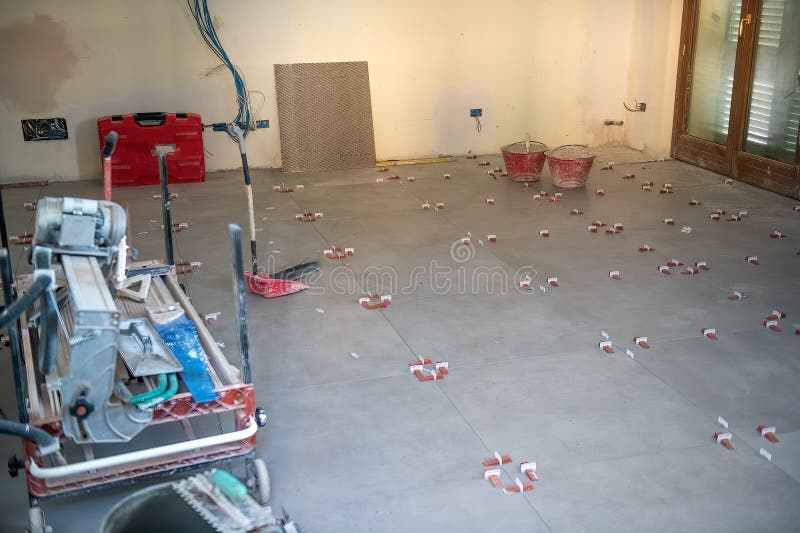 Laying Down Tiles in a New House. Room Witha New Set of Tiles Stock ...