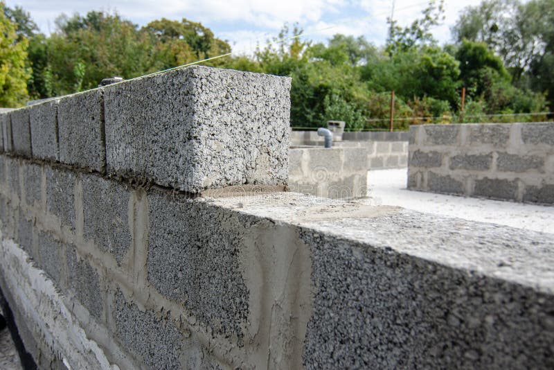 Laying of Expanded Clay Concrete Blocks during the Construction of a ...