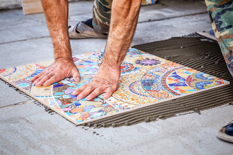 Laying floor ceramic tile stock image. Image of modern - 115573137