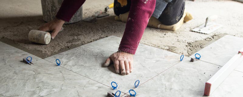 Laying Floor Ceramic Tile. Renovating the Floor Stock Photo - Image of ...
