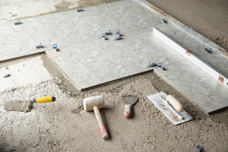 Laying Floor Ceramic Tile. Tools for Renovating Floor Stock Photo ...