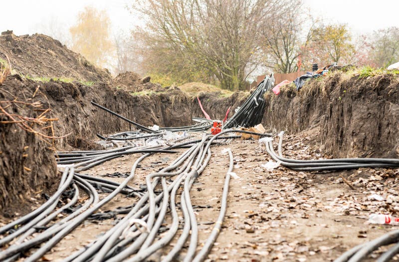 Laying of High-voltage Cable Lines in the Earth Trench Stock Photo ...