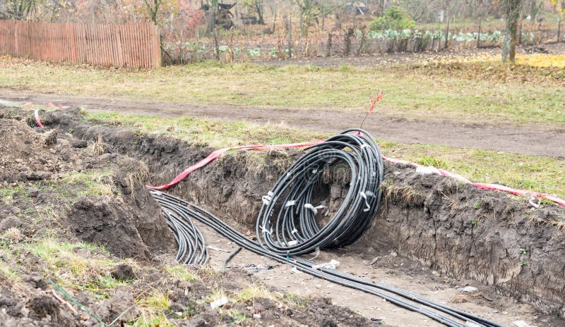 Laying of High-voltage Cable Lines in the Earth Trench Stock Image ...