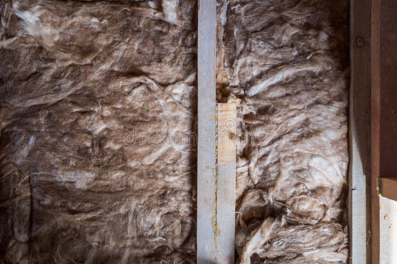 Laying Insulation on the Floor in a Frame House Under Construction ...